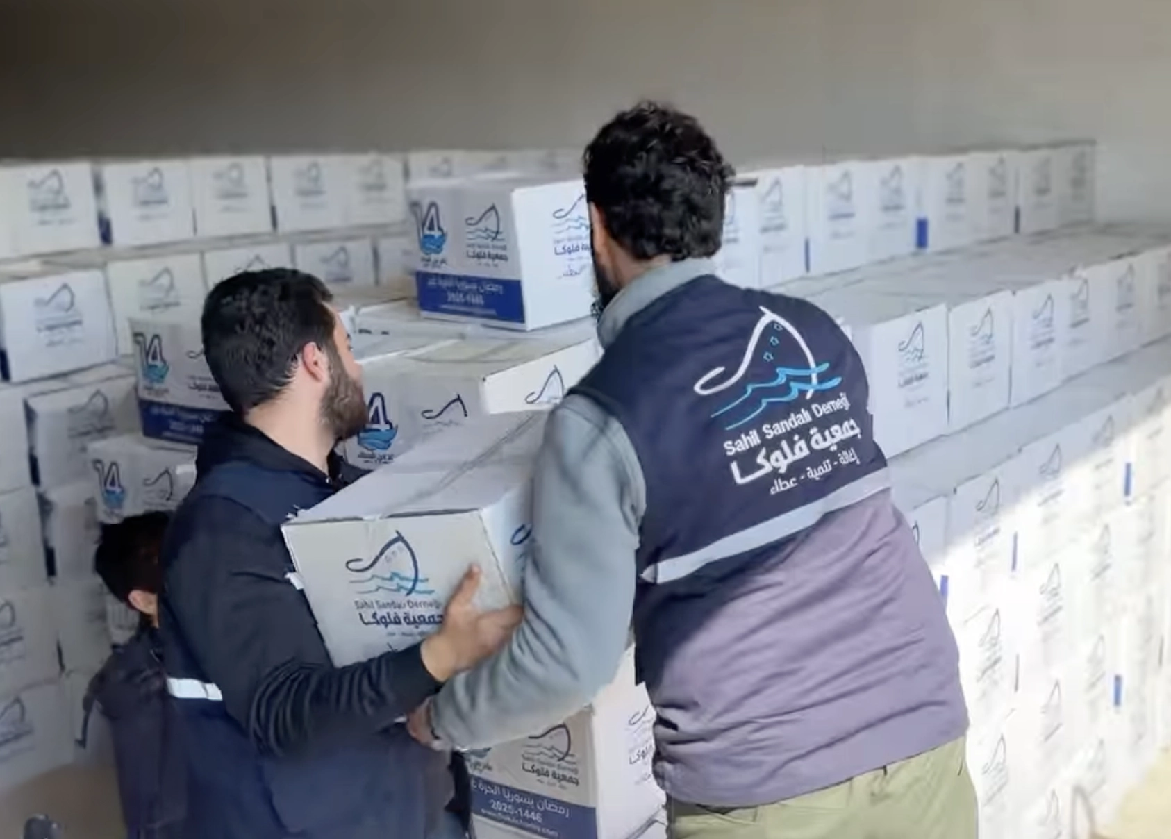 Organized Distribution of Food Baskets in Latakia Neighborhoods While ...
